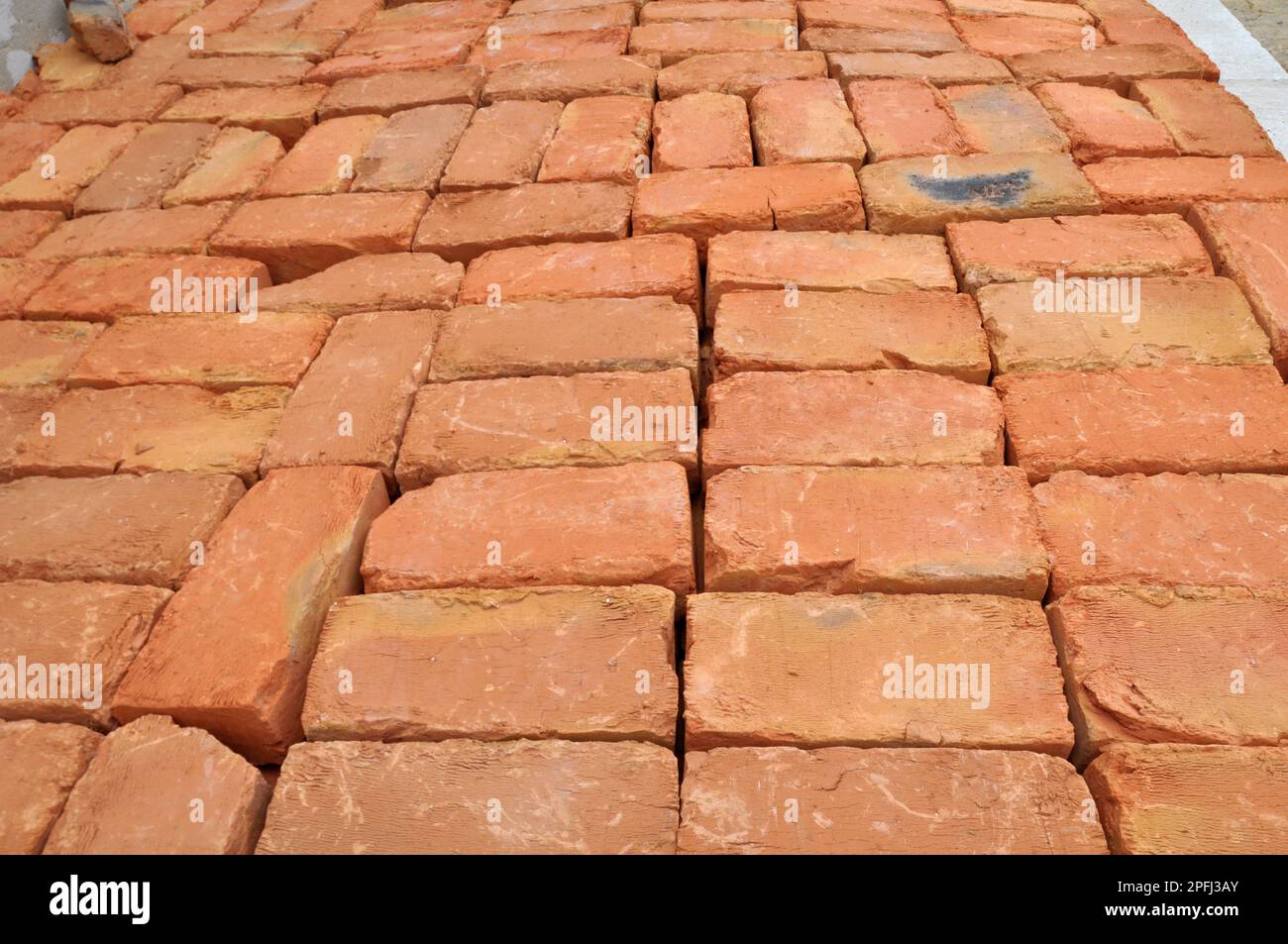 In the pile is a ready-made fired brick made of clay Stock Photo - Alamy