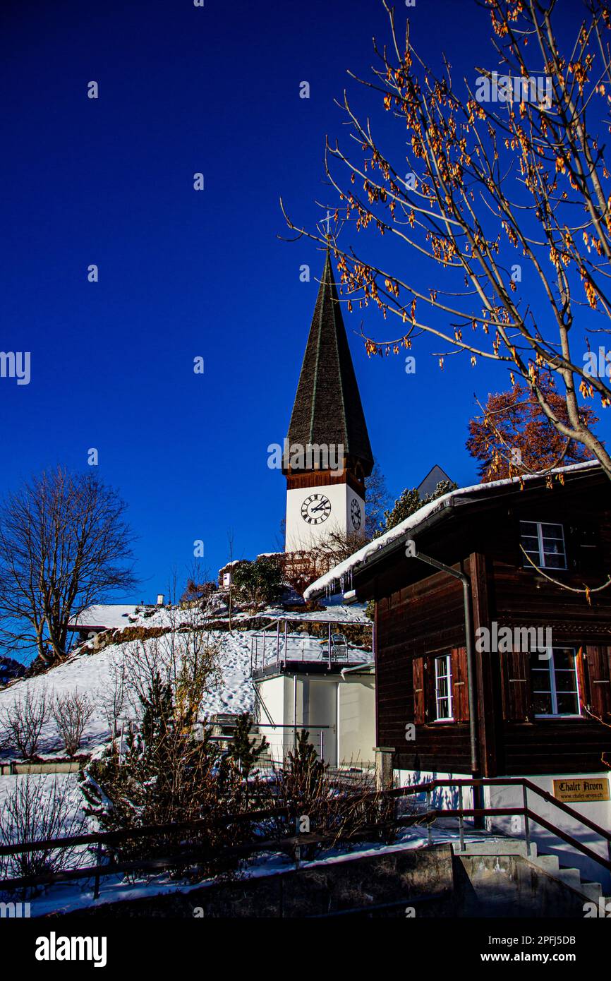 Beautiful view of the Catholic church in the village, in the Swiss Alps ...