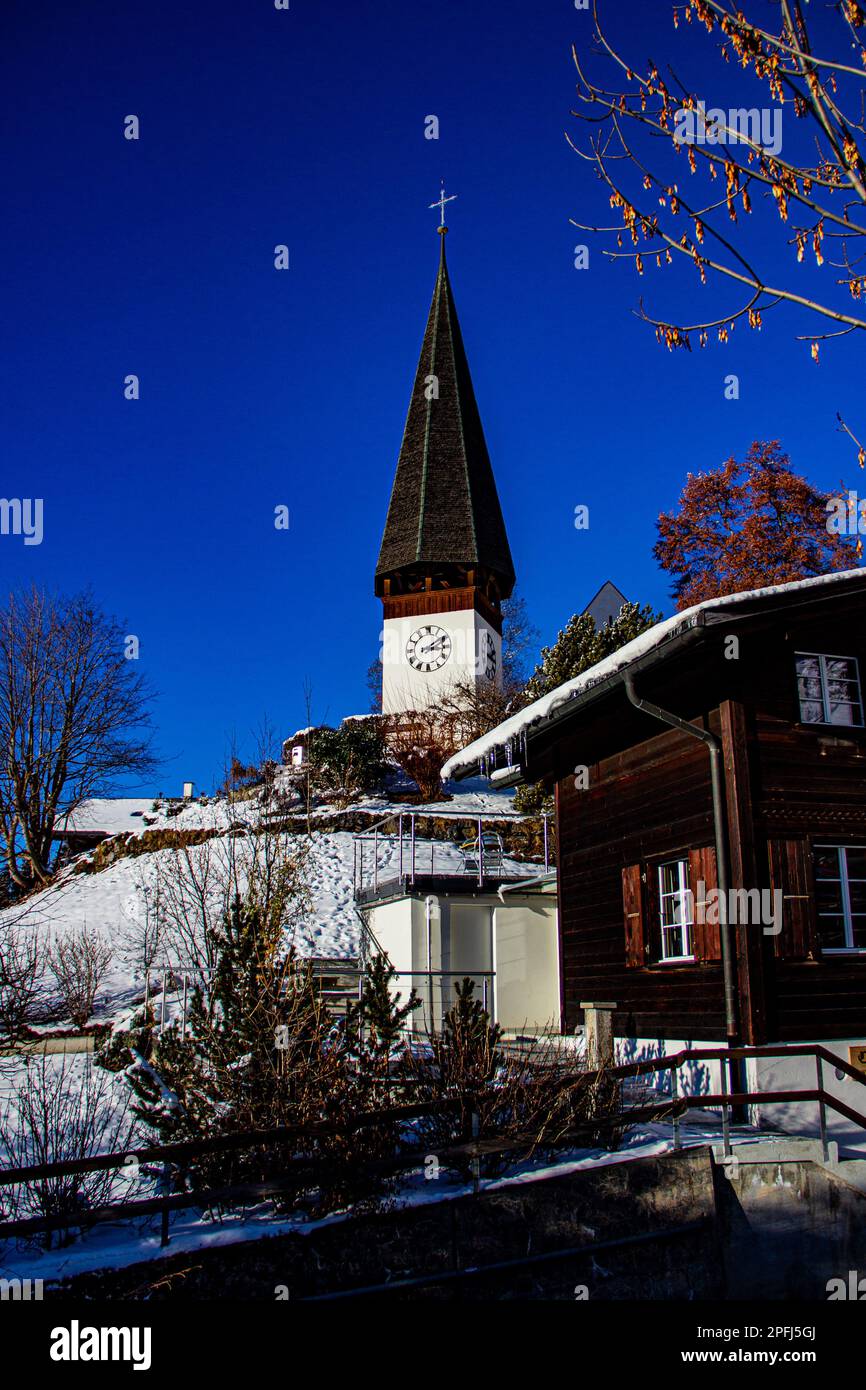 Beautiful view of the Catholic church in the village, in the Swiss Alps ...