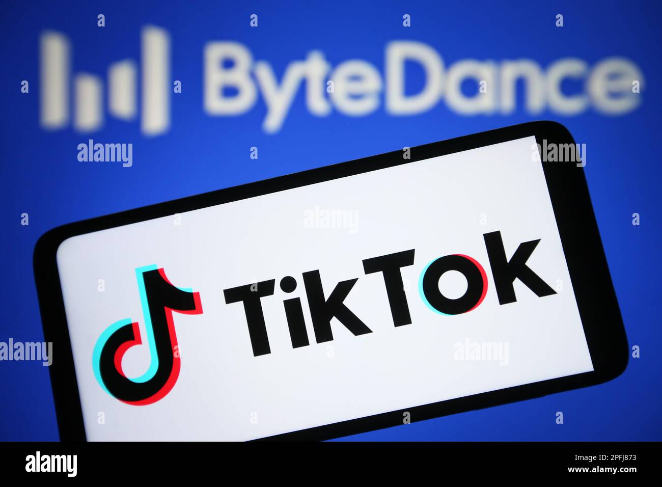 In this photo illustration, a TikTok logo is seen on a smartphone and ByteDance logo in the ...