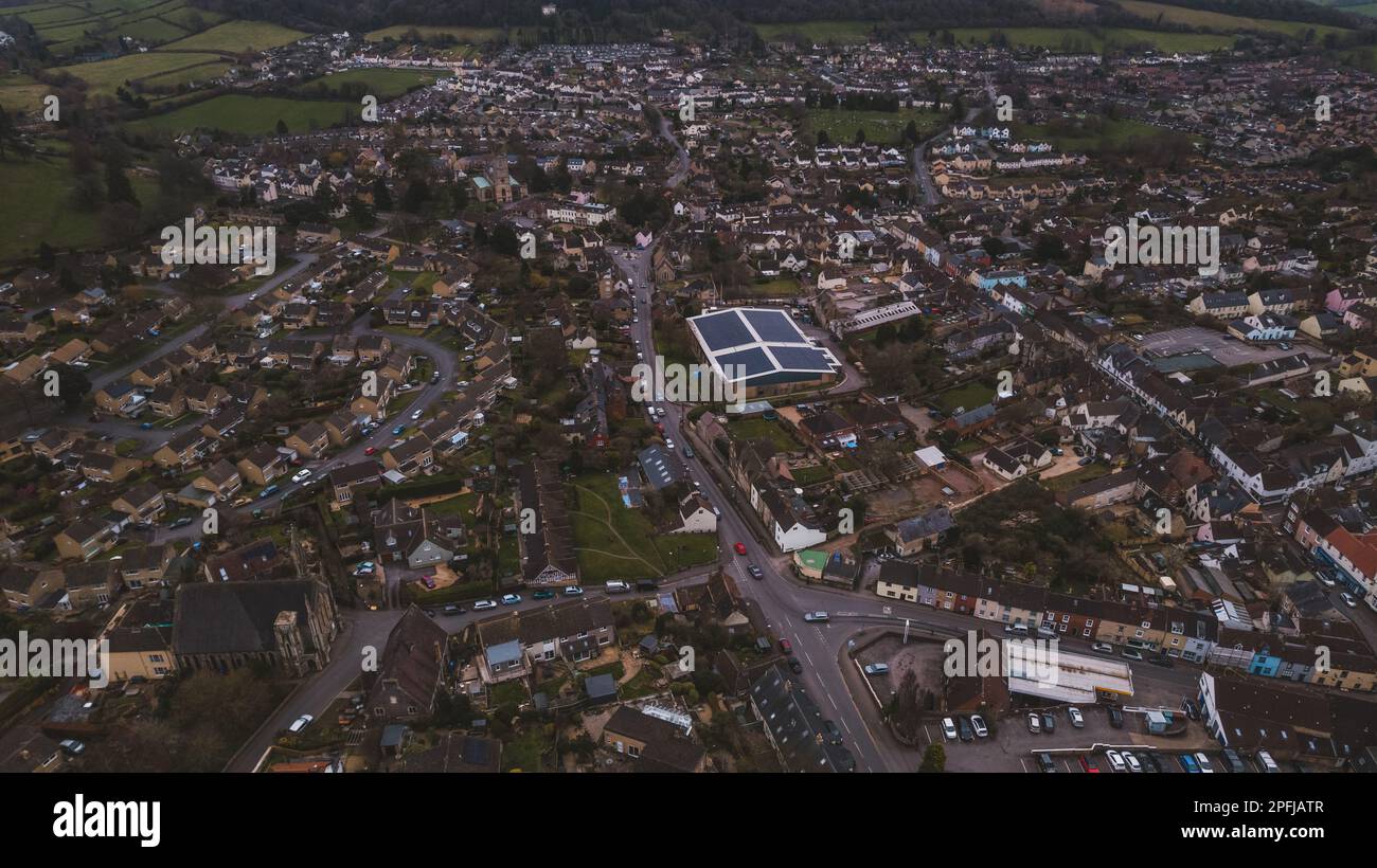 Aerial view of neighborhood surrounded by green landscape Stock Photo ...