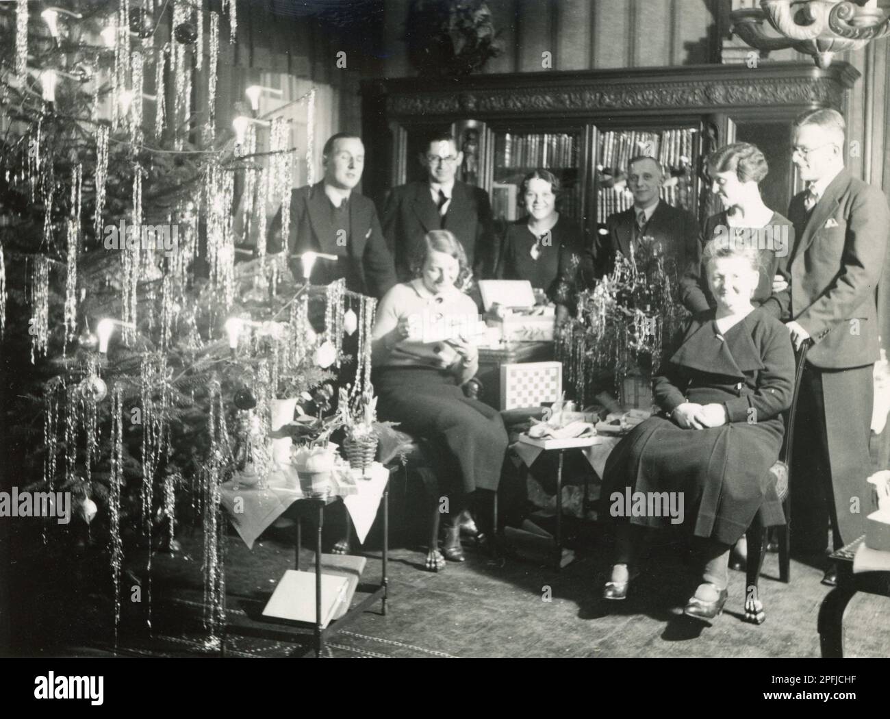 Vintage Christmas, Old-time Christmas, About 1910 or 1920s. Family celebrating Christmas with ...