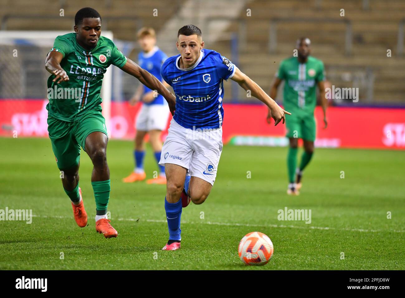 Virton's Keres Masangu and Jong Genk's Cedric Nuozzi pictured in action during a soccer match ...