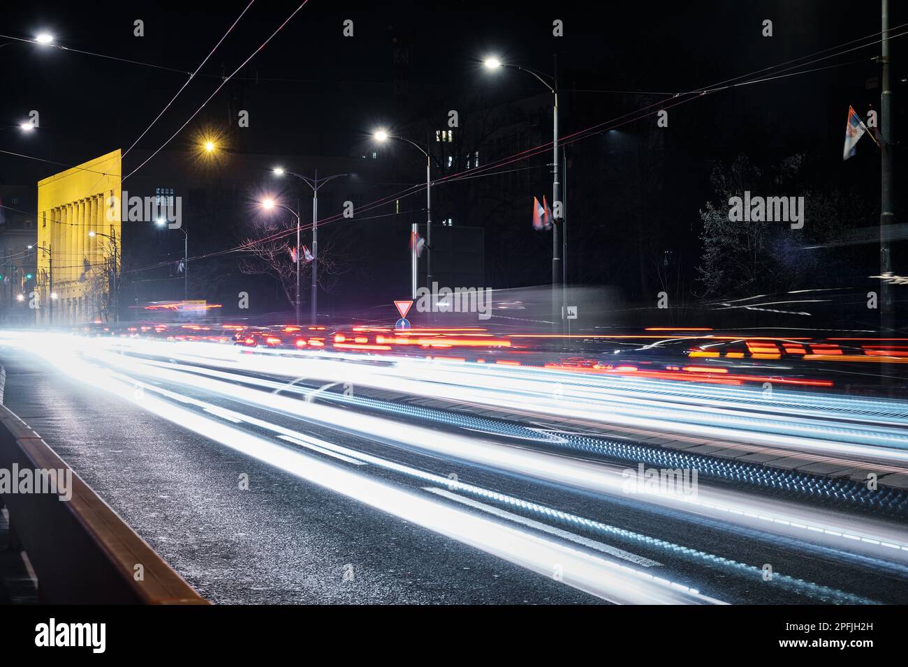 Light trails of car headlights and taillights. Driving cars captured ...