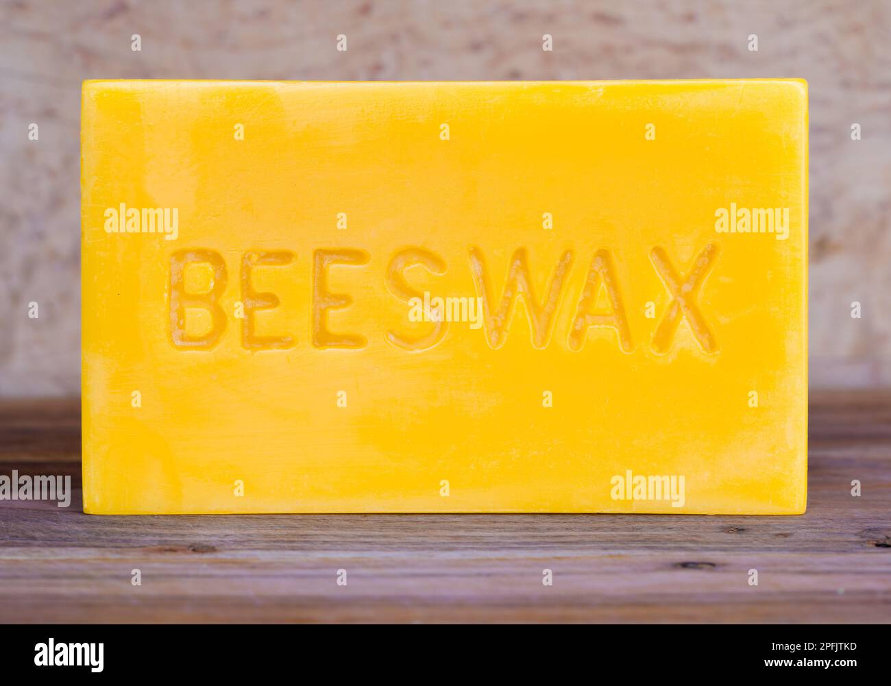 Front view of a brick of pure beeswax on a wood background Stock Photo ...