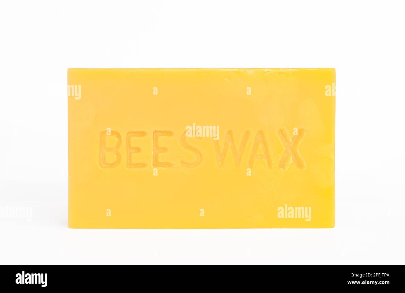 Front view of a brick of pure beeswax on a white background Stock Photo ...