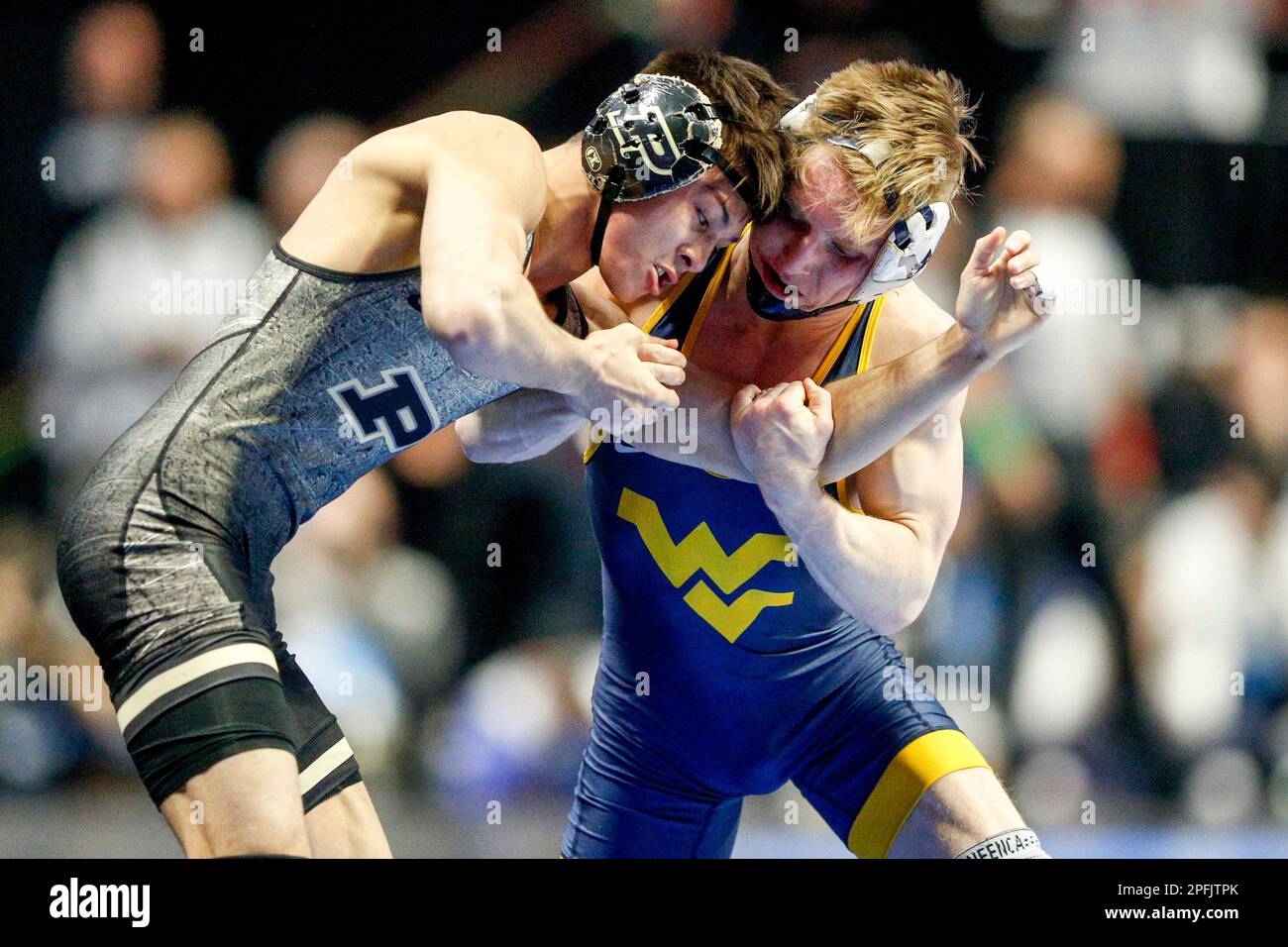 Purdue's Matt Ramos ties up with West Virginia's Killian Cardinale at ...