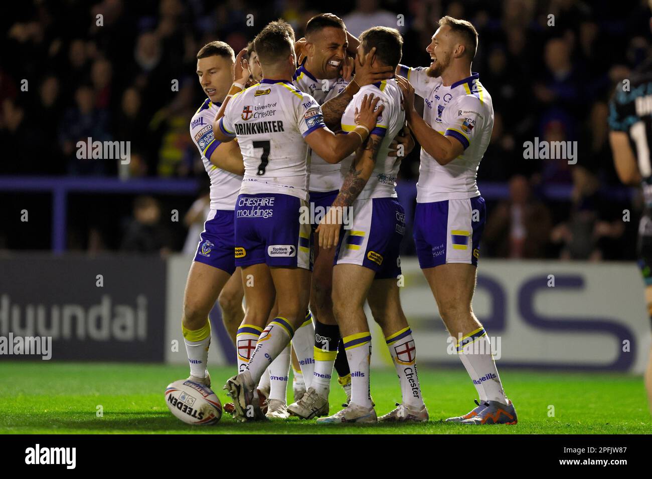 Warrington Wolves Paul Vaughan is mobbed after he scores during the ...