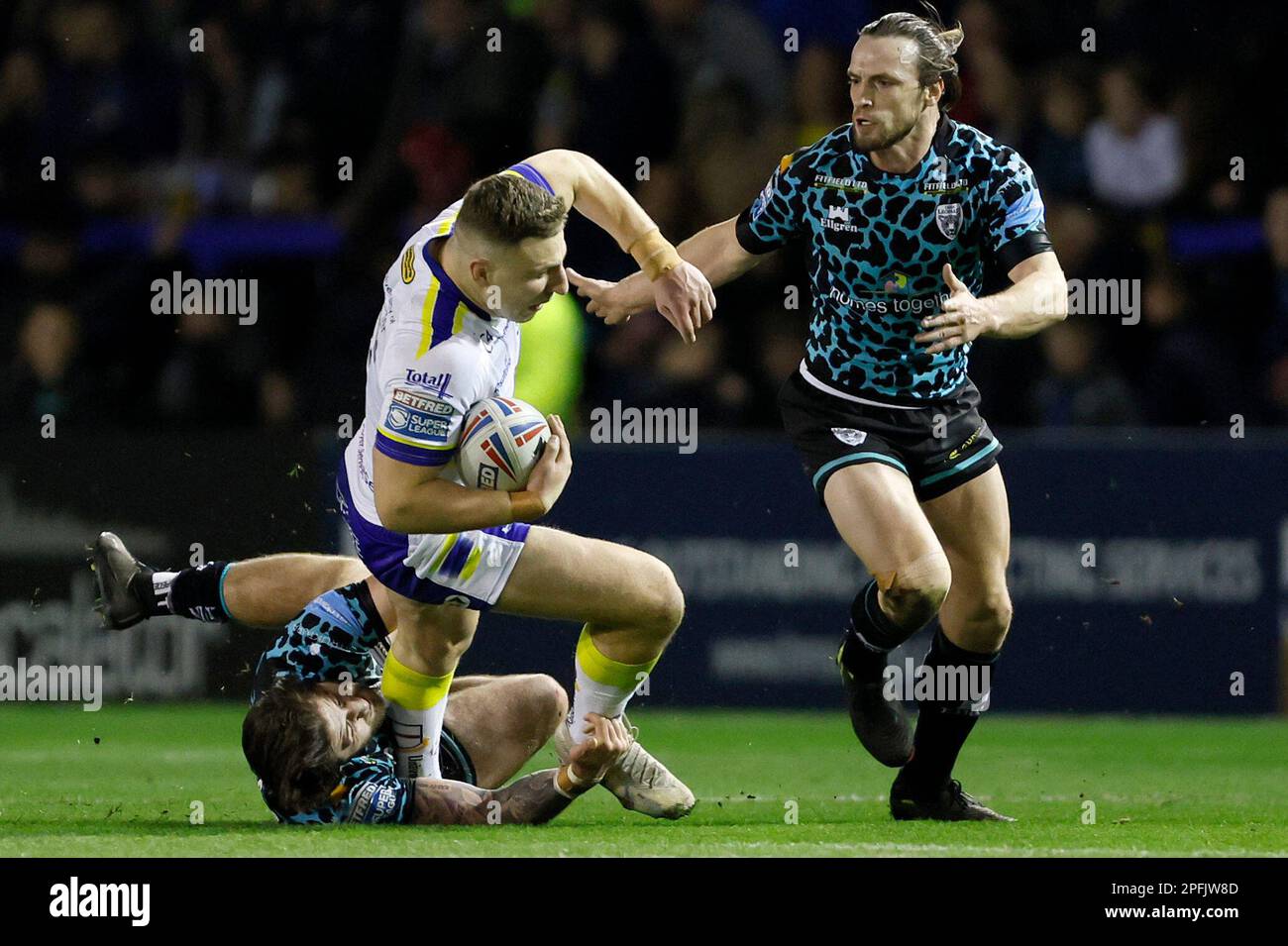 Warrington Wolves George Williams gets tackled during the Betfred Super ...