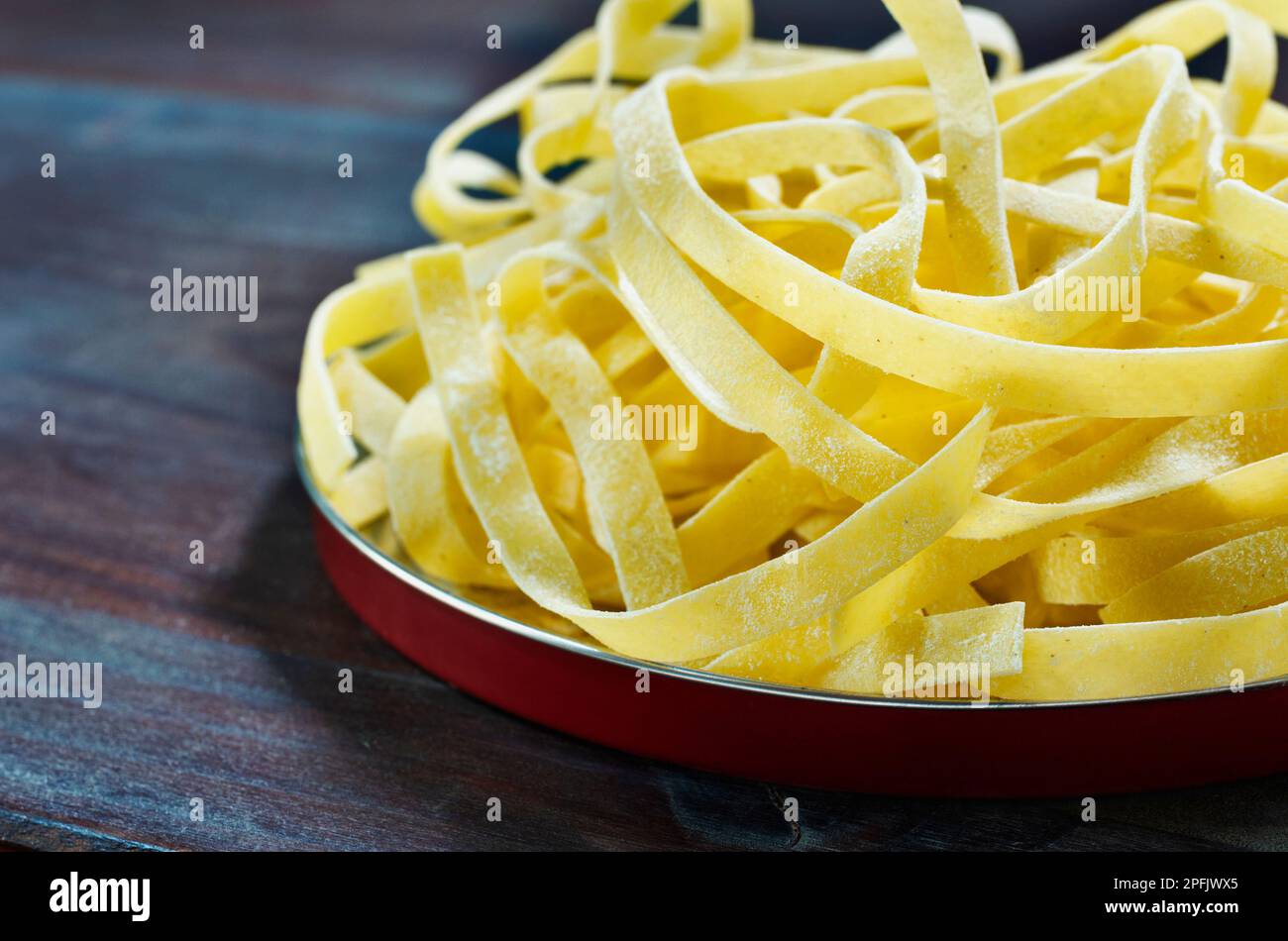Plate with dried fettuccine , long flat pasta, healthy eating Stock ...