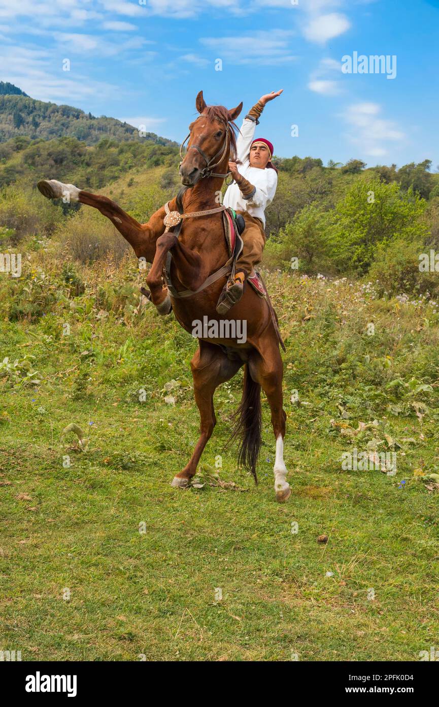 Man on a rearing horse, Kazakh ethnographic village Aul Gunny, Talgar ...