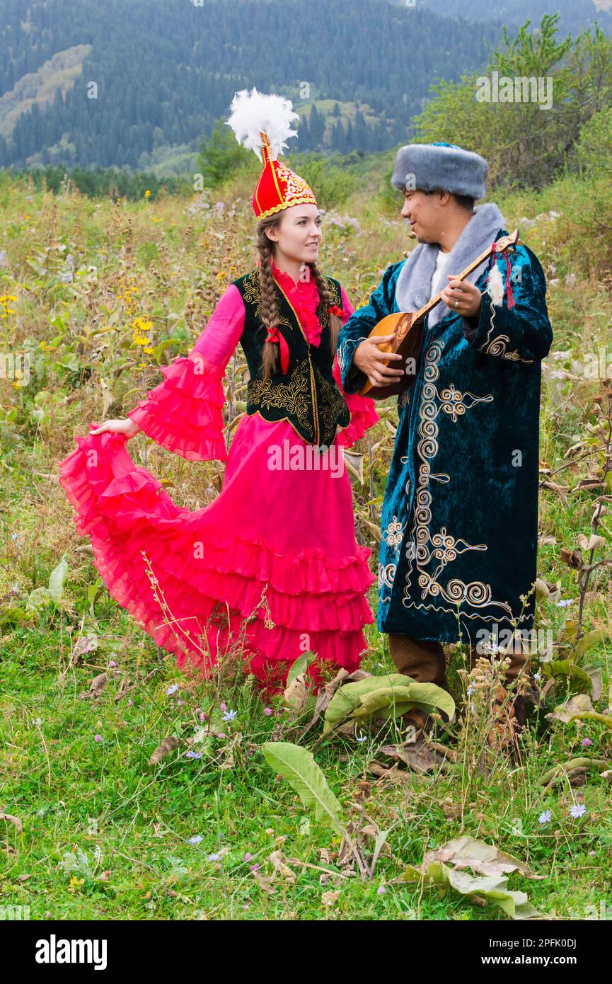 Kazakh man singing and playing dombra for a woman, Central Asia, Kazakh ...