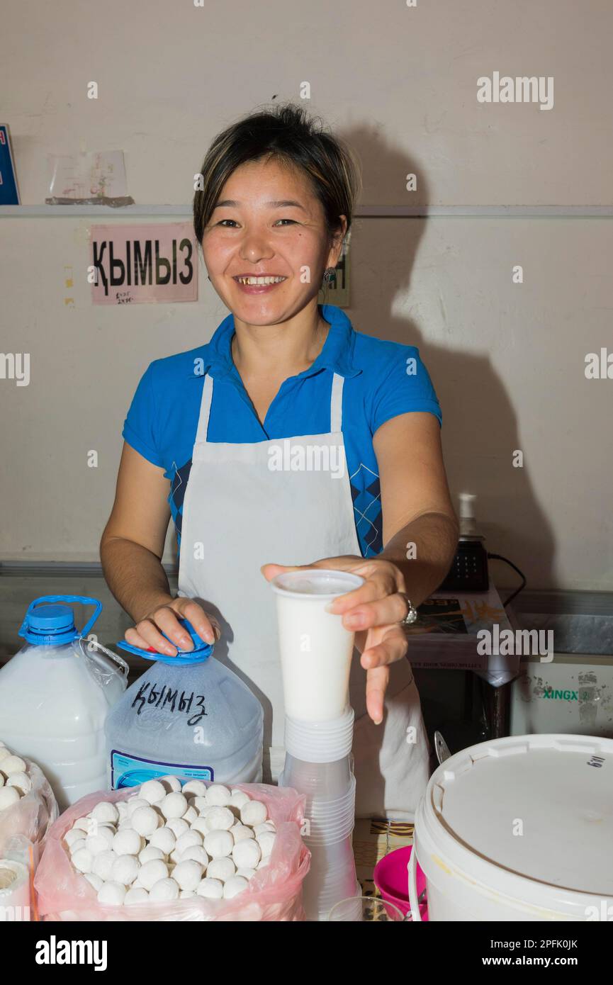 Kazakh woman selling kumis made from mare's milk, Samal Bazar, Shymkent ...