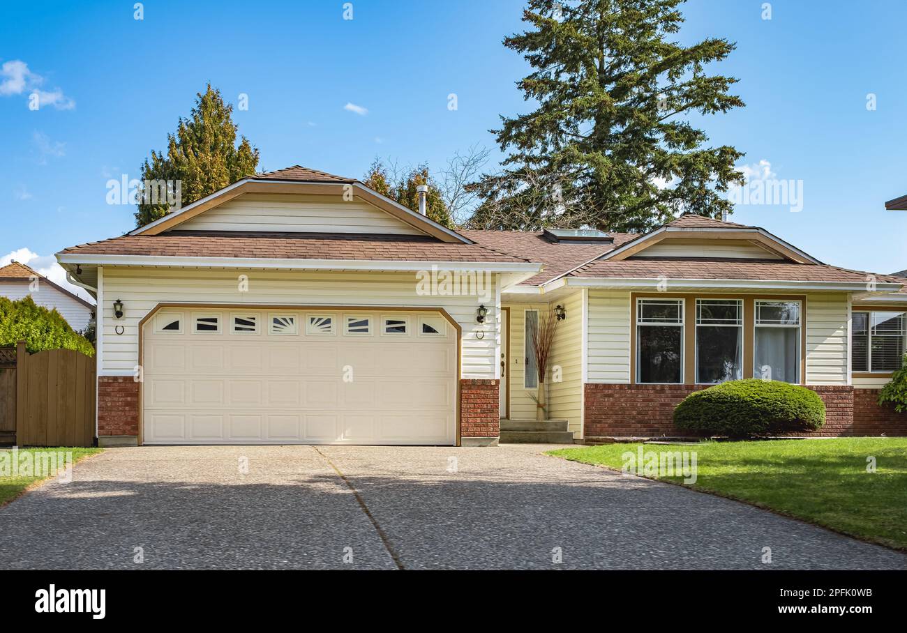 Real Estate Exterior Front House on a sunny day. Big custom made luxury ...