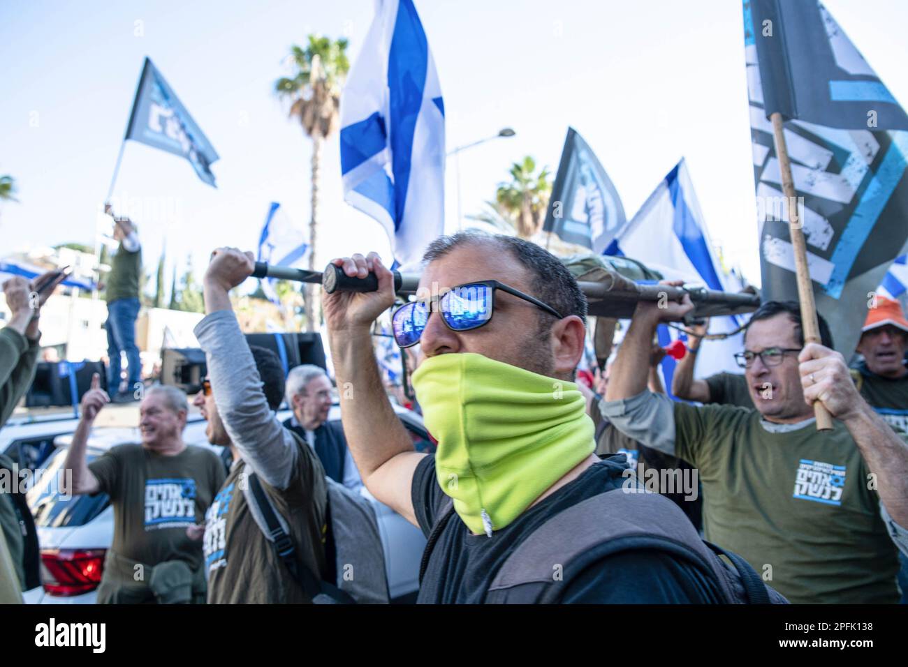 Bnei Brak, Israel. 16th Mar, 2023. Israeli reserve soldiers against the ...