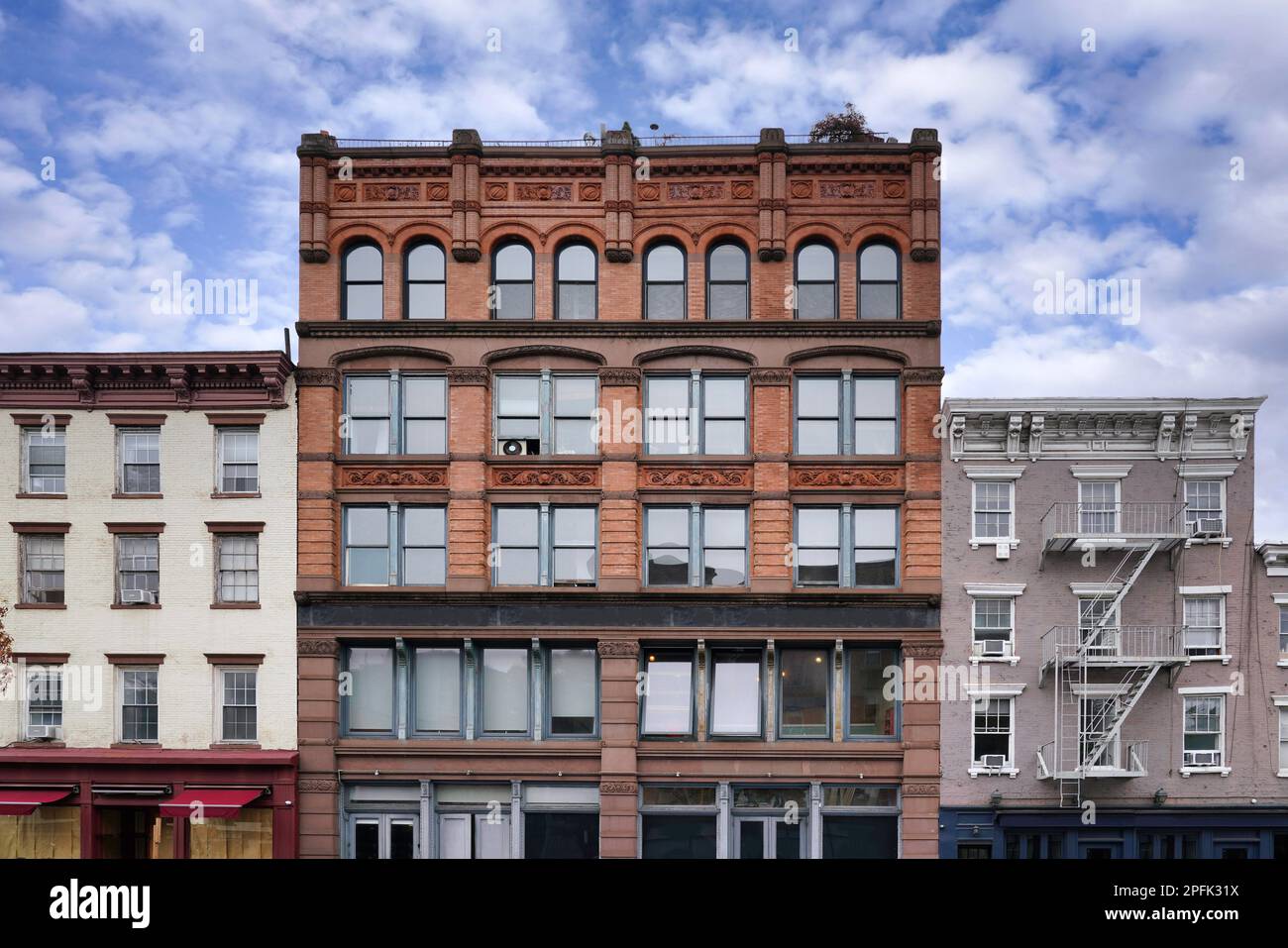 Street with facades of old fashioned apartment buildings Stock Photo ...