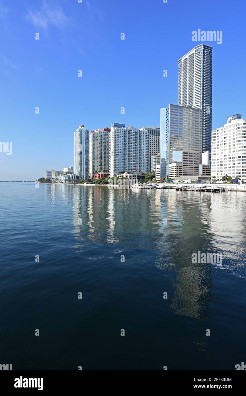 Residential towers reflected in calm water of Biscayne Bay in Miami ...