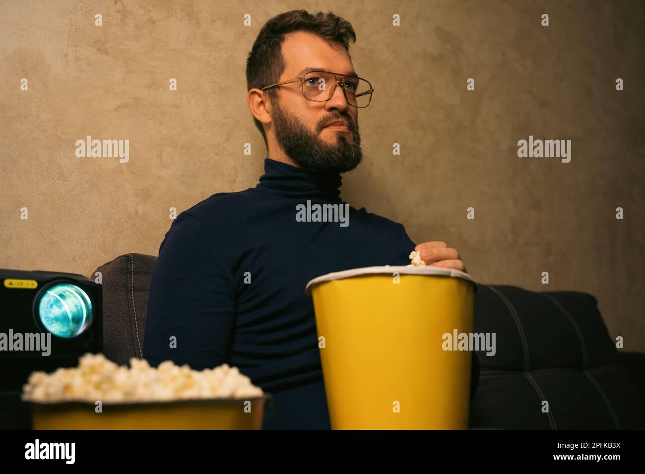Excited Millennial Man Watching Movie Using Domestic Cinema Projector ...