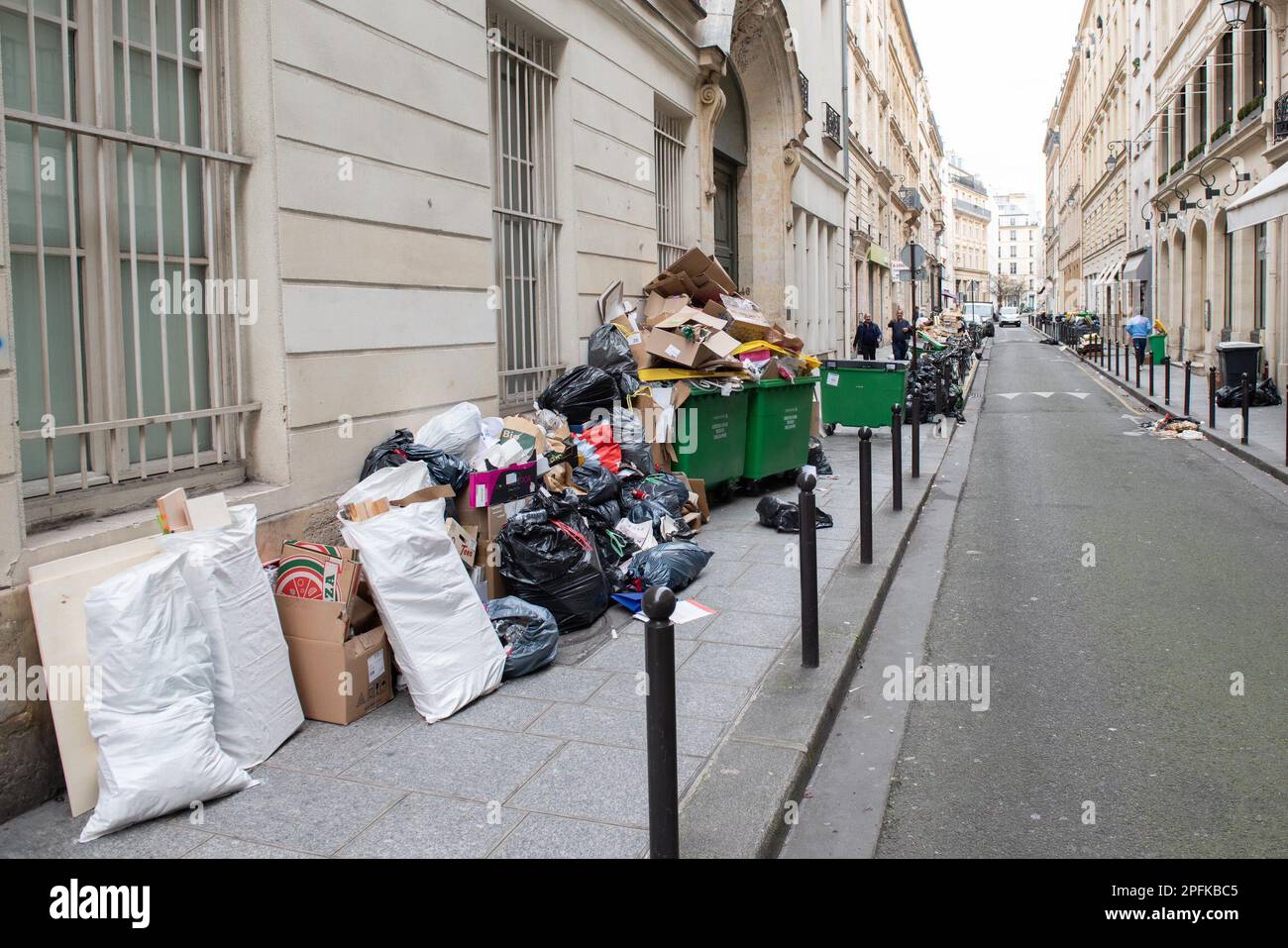 PARIS, FRANCE - MARCH 17: Rubbish and overflowing bins line a street in paris during a strike by ...