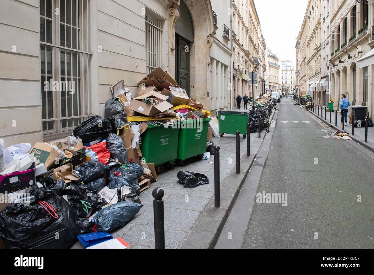 PARIS, FRANCE - MARCH 17: Rubbish and overflowing bins line a street in paris during a strike by ...