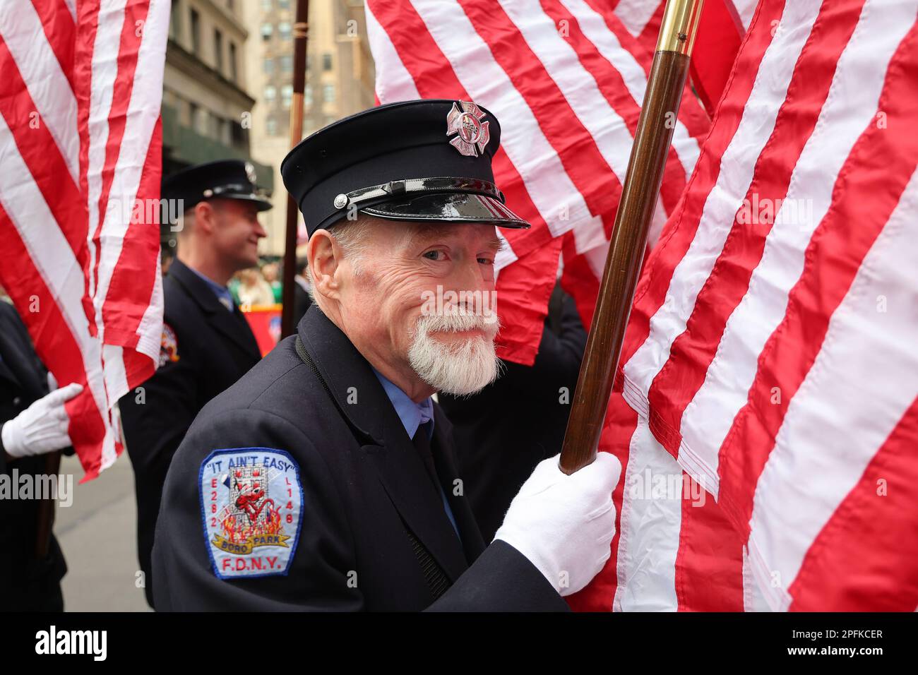 Members of the New York City Fire Department Color Guard carry flags ...