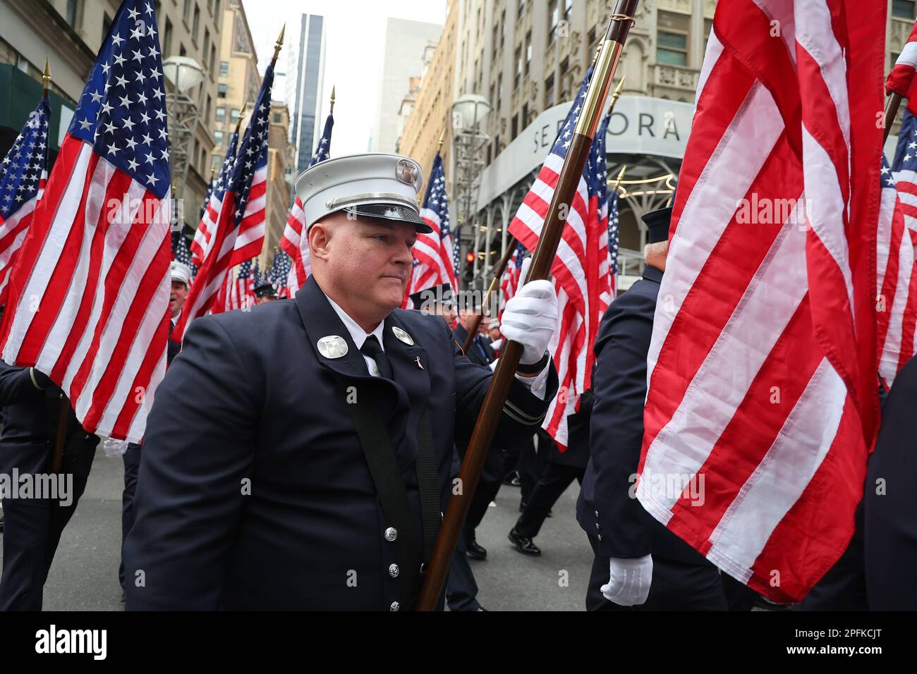 Members of the New York City Fire Department Color Guard carry flags ...