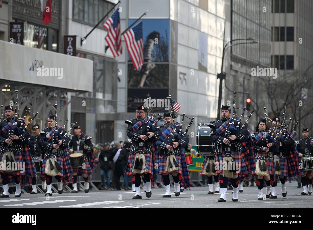 New York, USA. 17th Mar, 2023. A bagpipe marching band marches in the ...