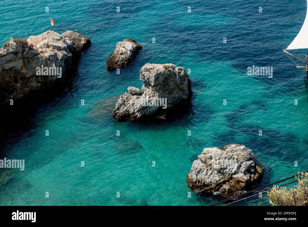 Bird's eye view of the blue sea, rocks in clear water, azure beach ...
