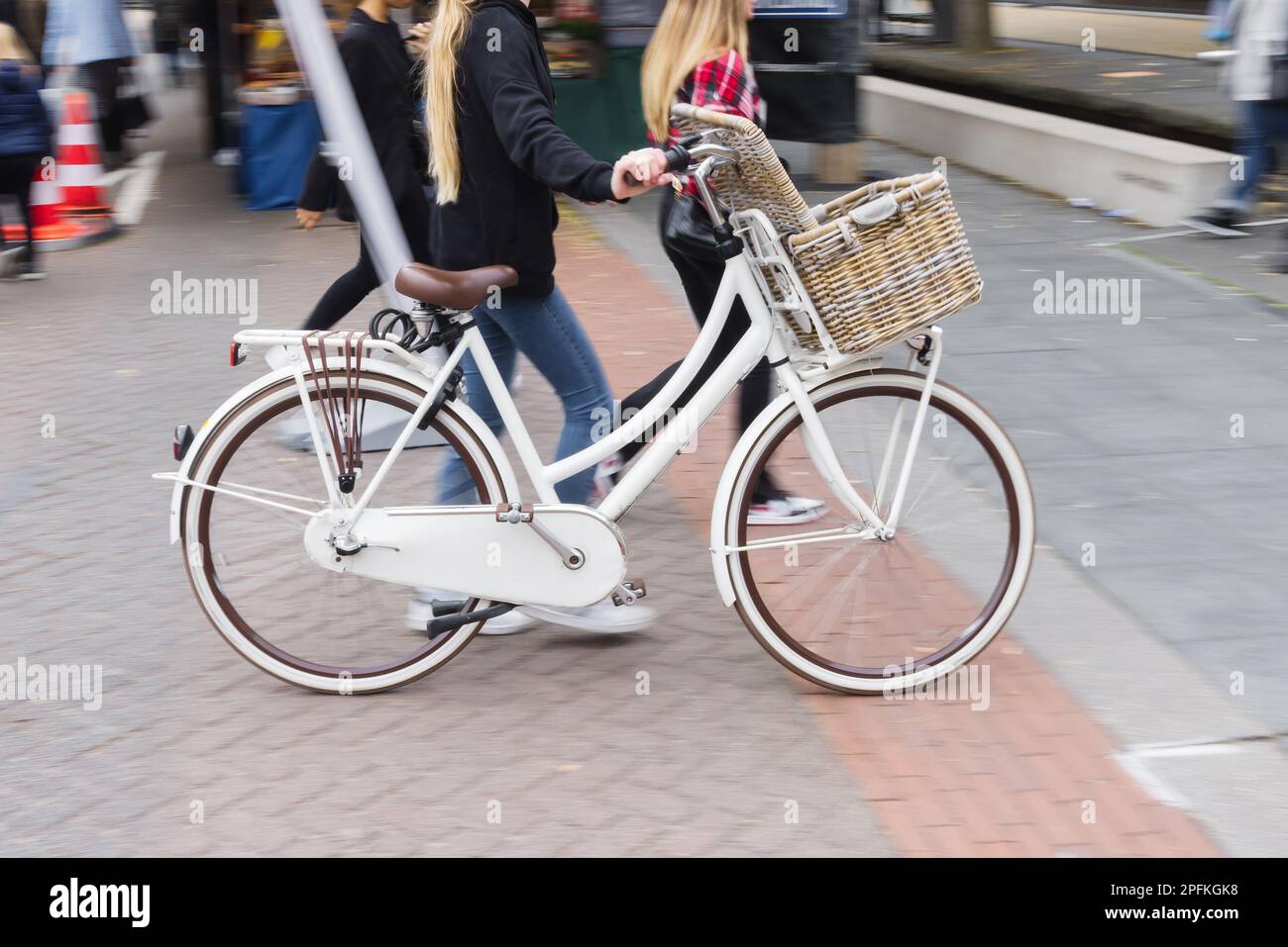 picture with camera made motion blur effect of a woman pushing a ...