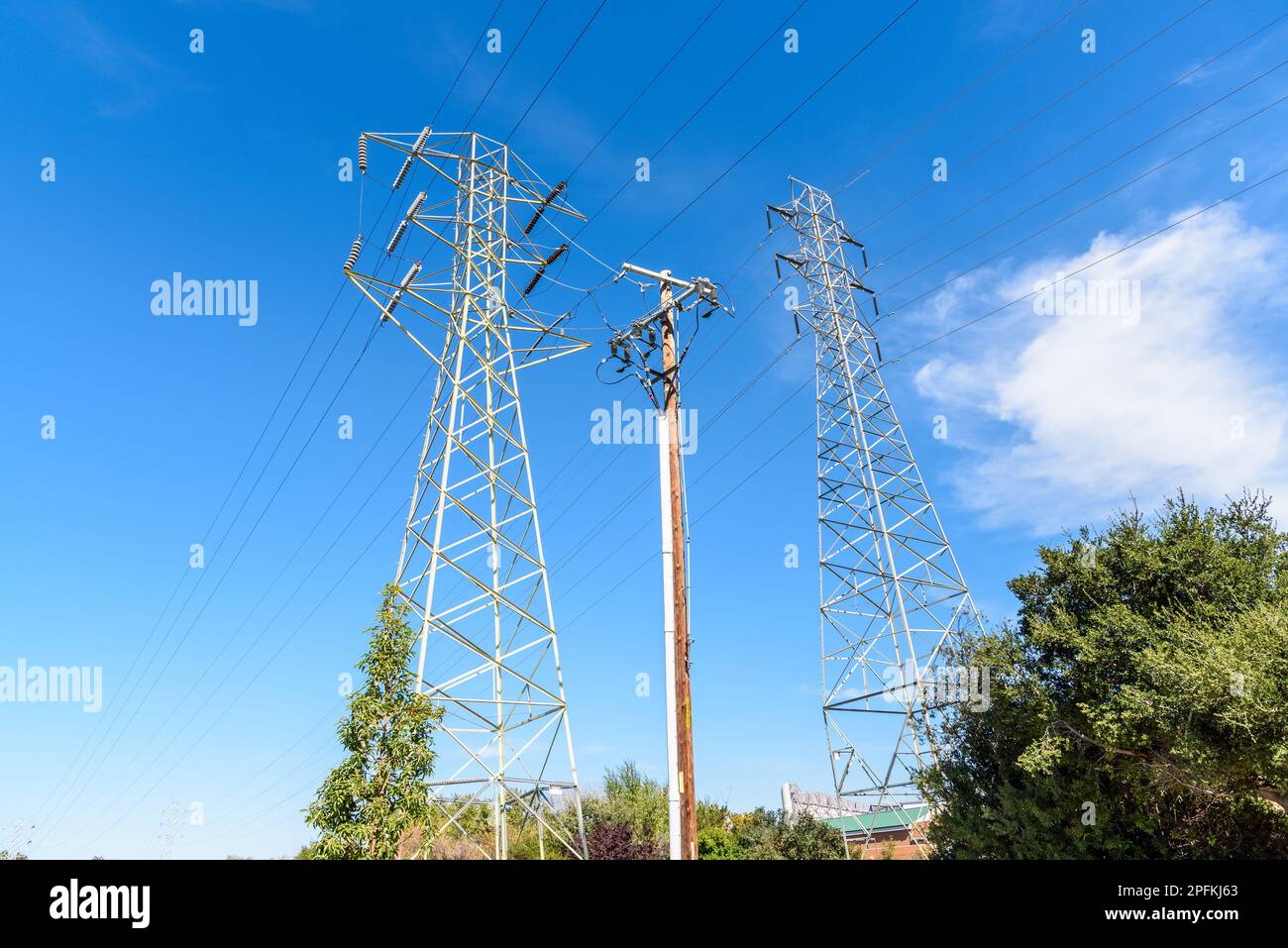 Pylons supporting high voltage cables on a clear autumn day Stock Photo ...