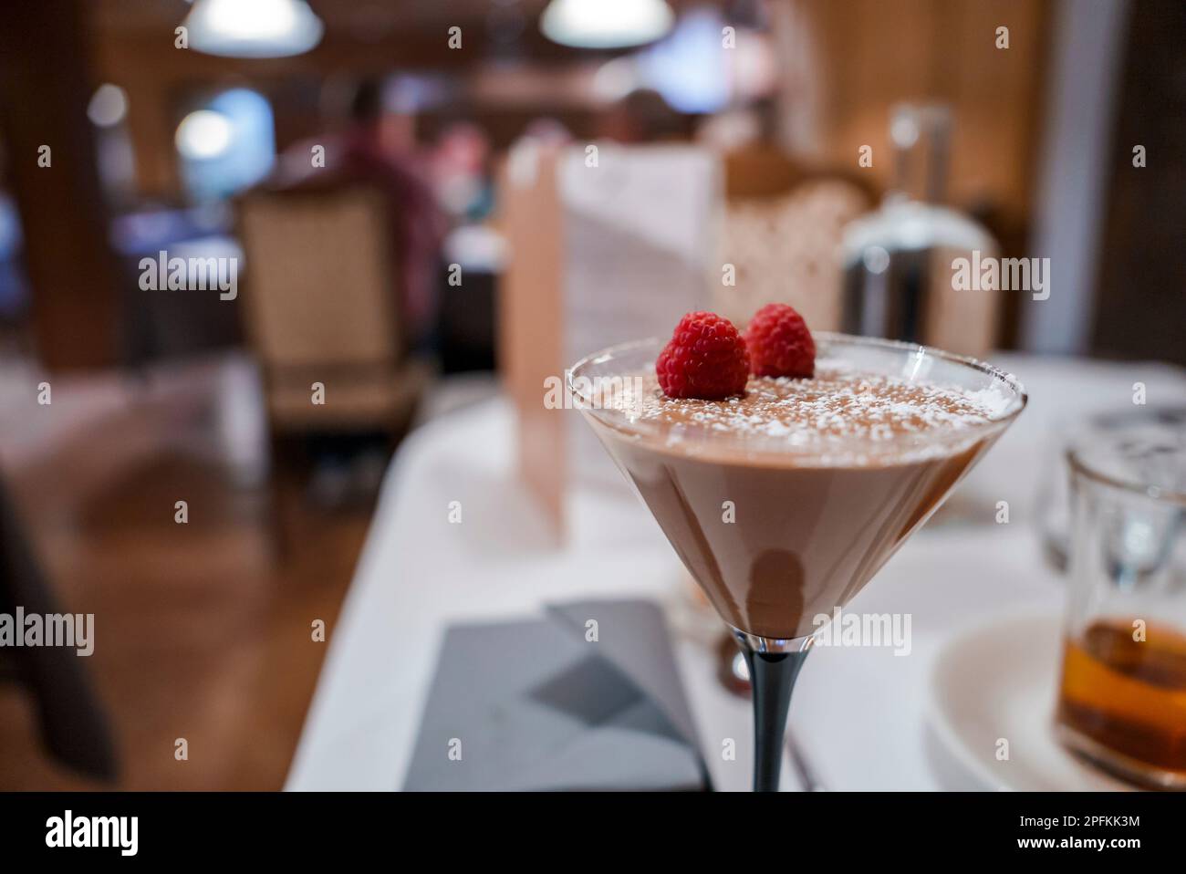Raspberries on delicious drink served in restaurant Stock Photo - Alamy
