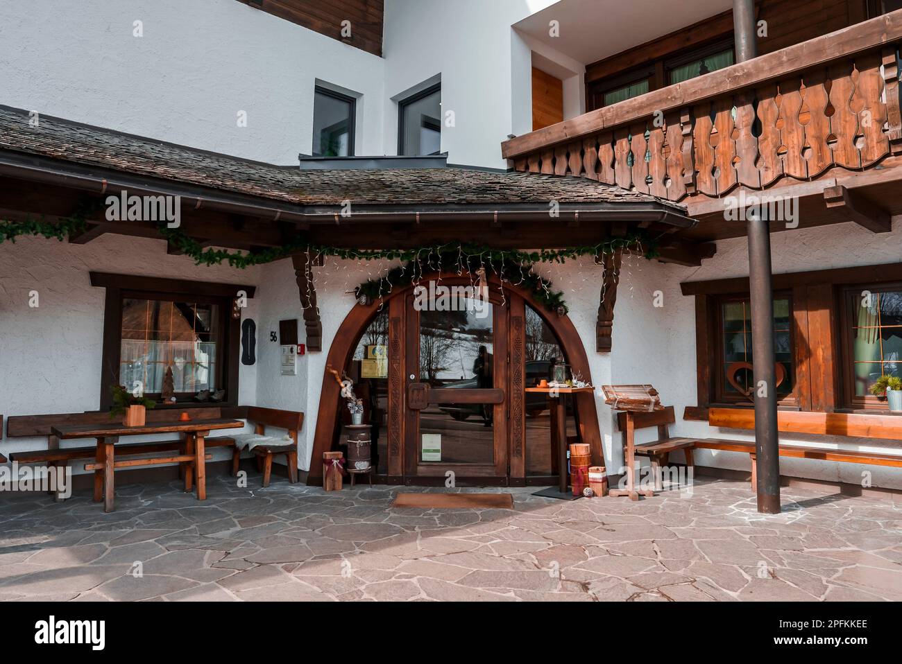 Hotel building with benches and seats at entrance Stock Photo - Alamy