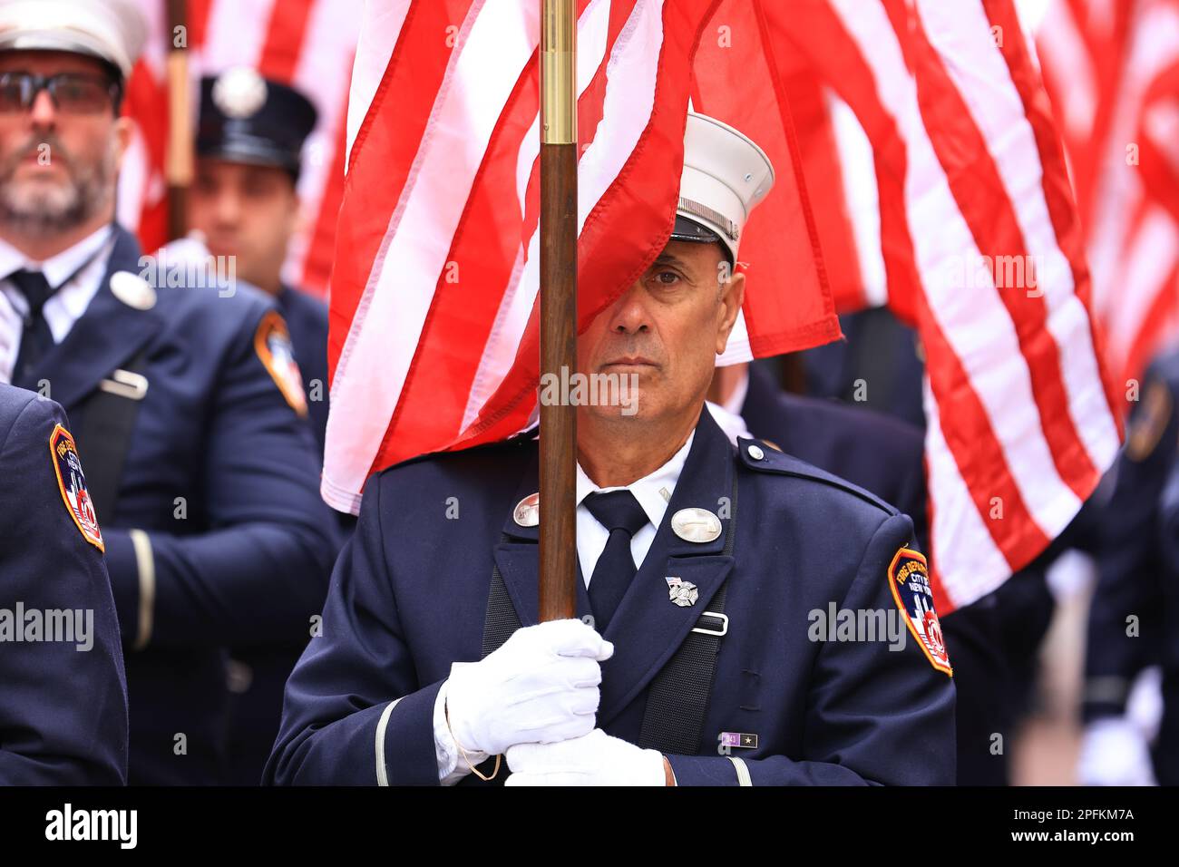 Members of the New York City Fire Department Color Guard carry flags ...