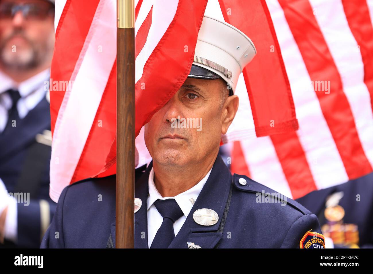 Members of the New York City Fire Department Color Guard carry flags ...