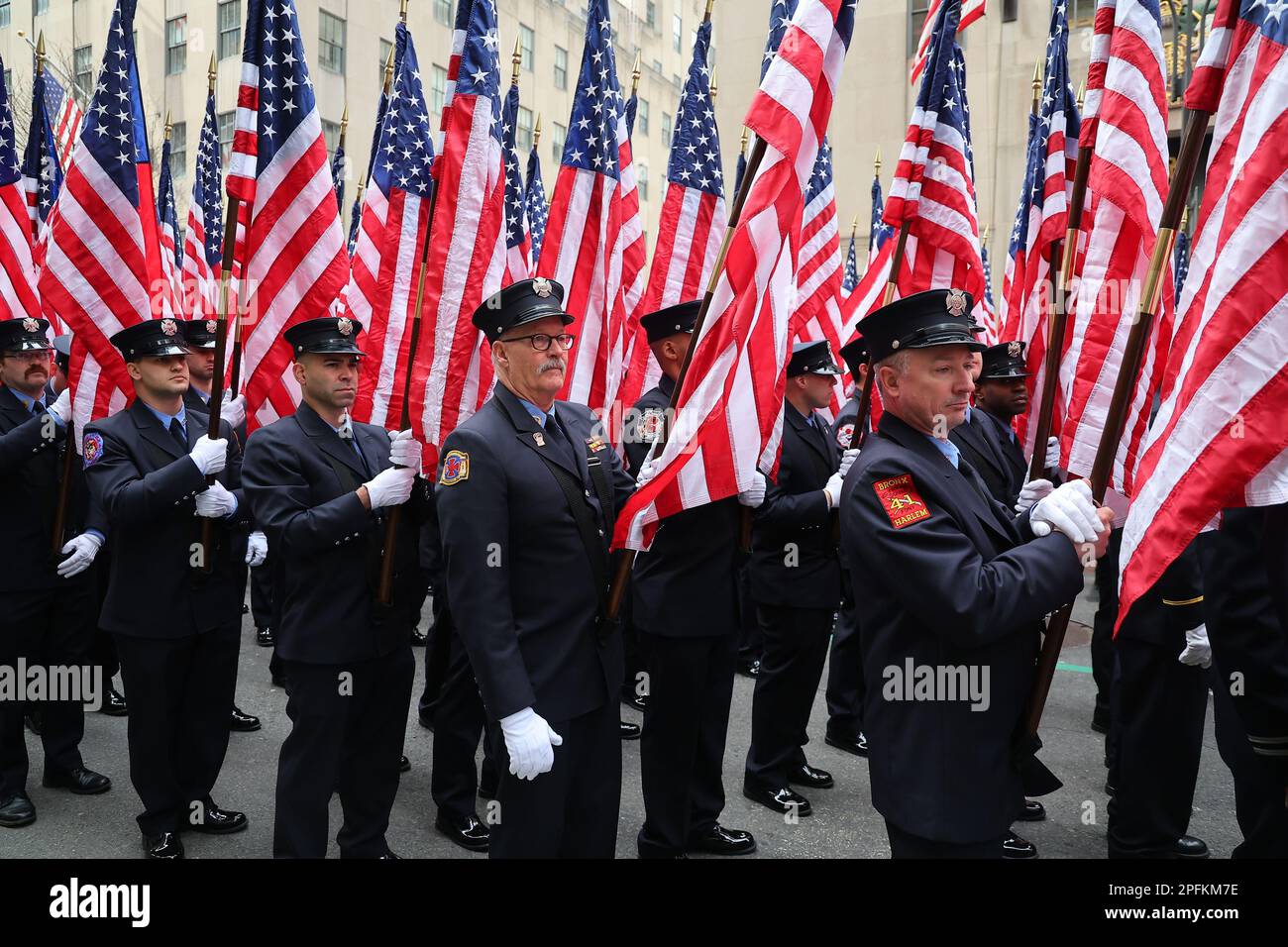 Members of the New York City Fire Department Color Guard carry flags ...
