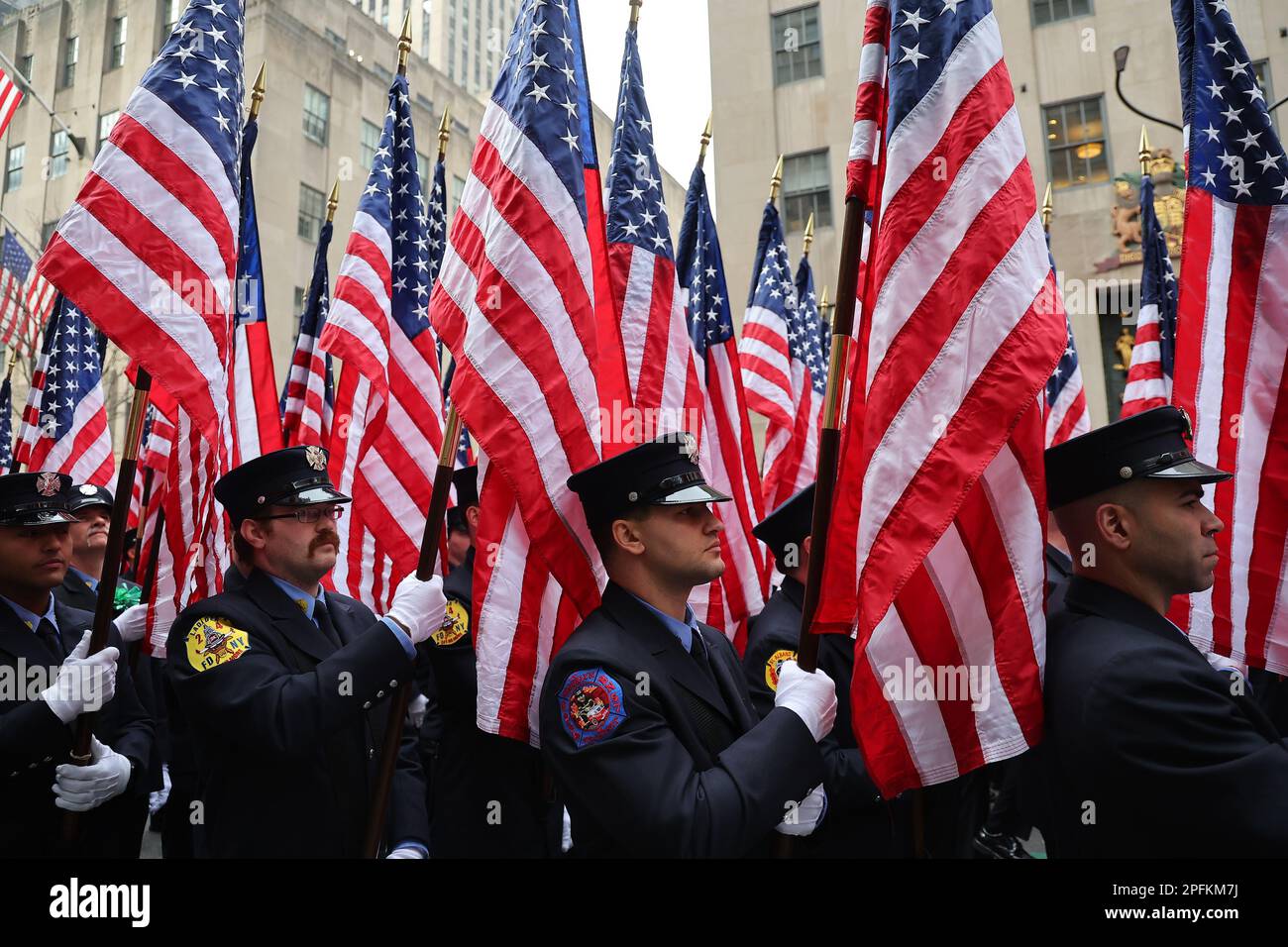 Members of the New York City Fire Department Color Guard carry flags ...