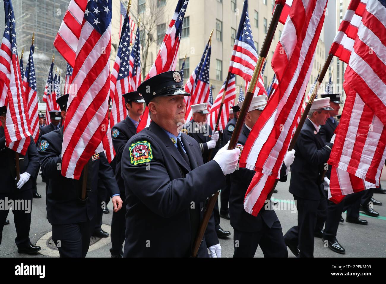 Members of the New York City Fire Department Color Guard carry flags ...