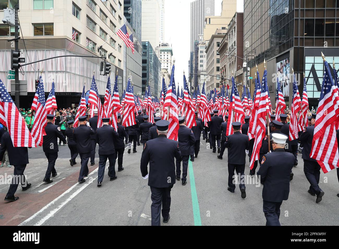 Members of the New York City Fire Department Color Guard carry flags ...