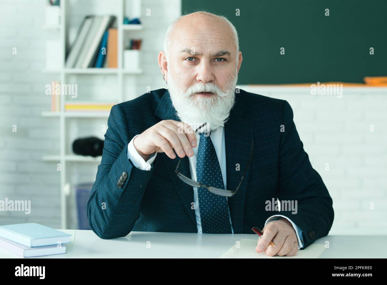 Senior professor serious. School teacher or college and university ...