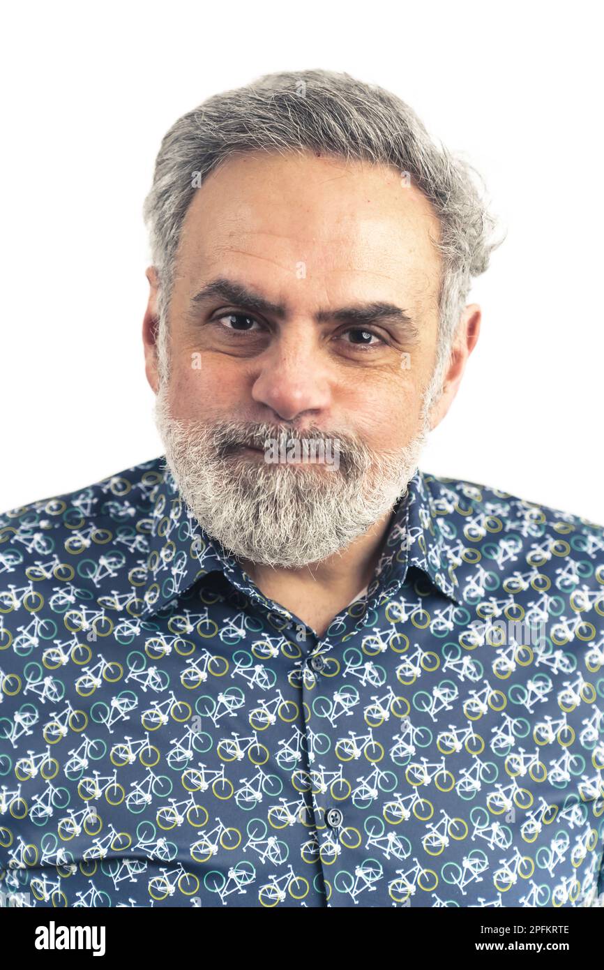 Smiling middle-aged bearded man in a blue funky shirt making a funny ...