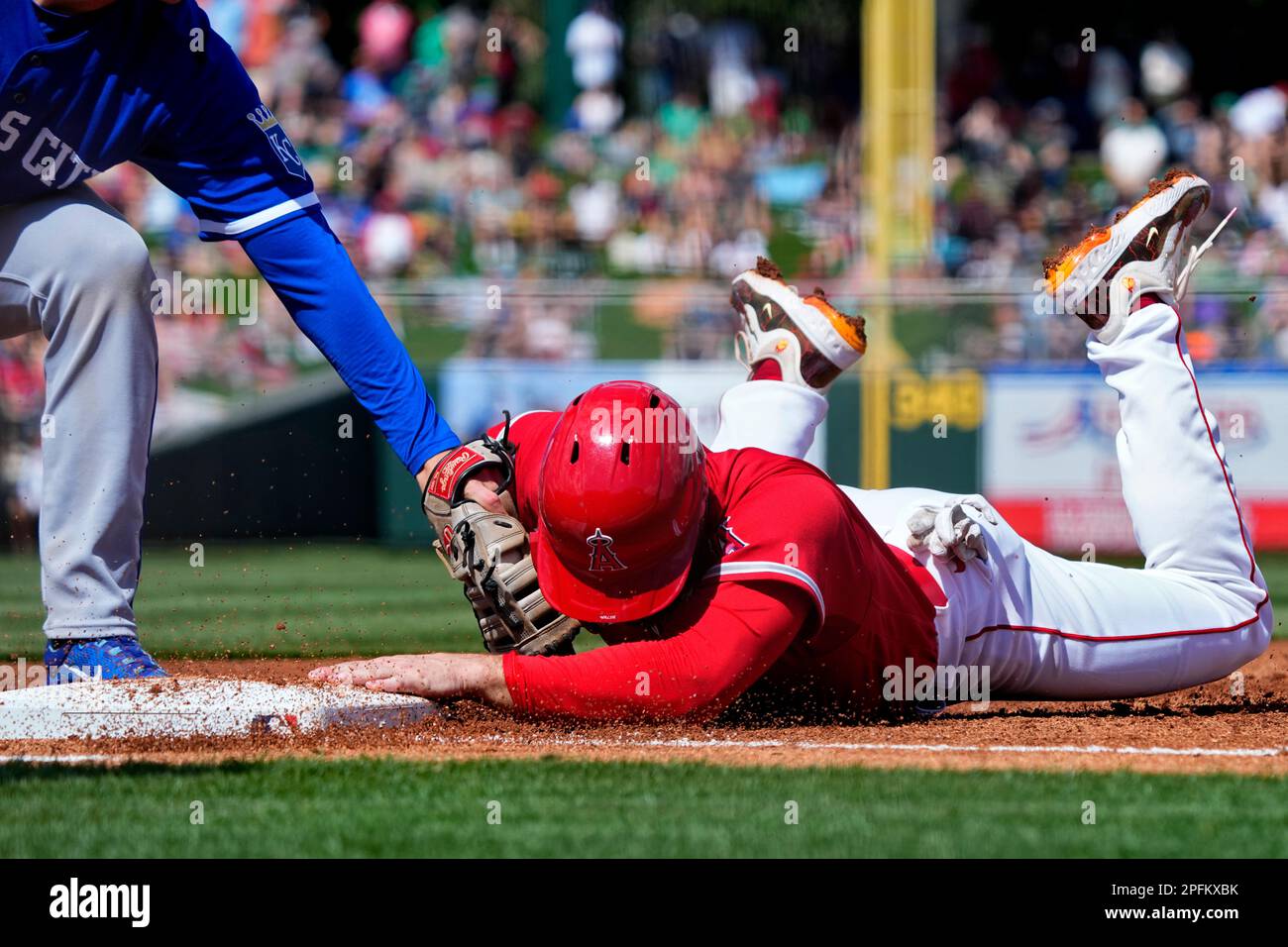 Los Angeles Angels' Jared Walsh dives back safely as Kansas City Royals ...