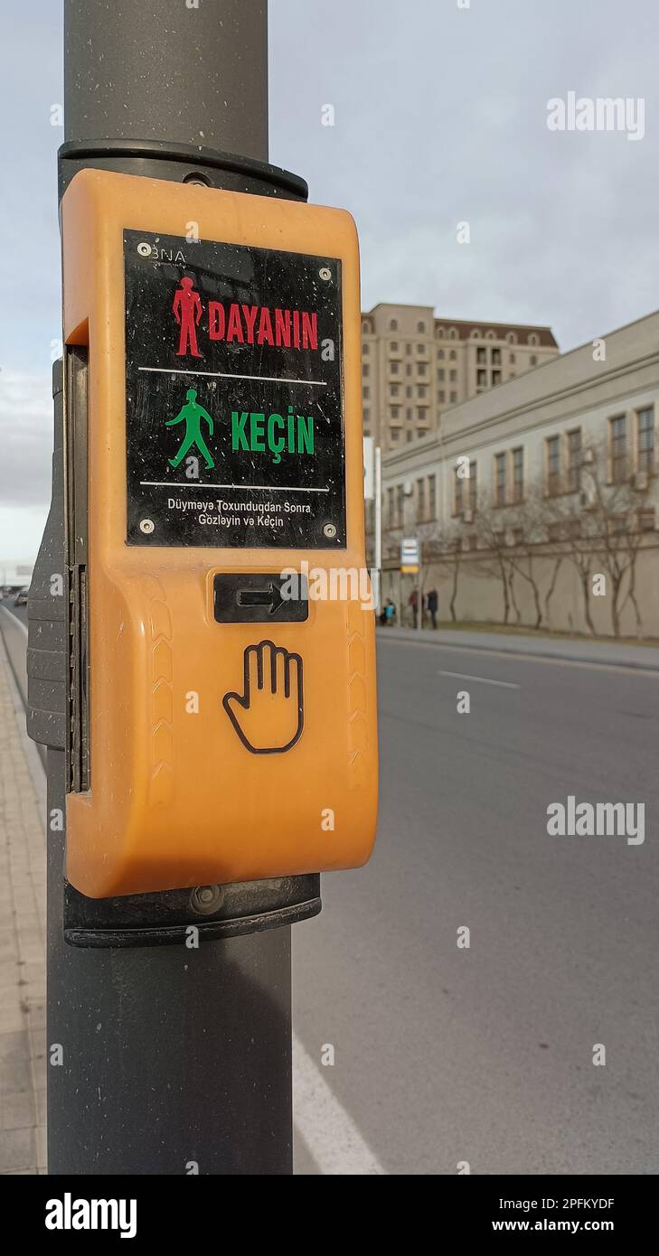 Traffic light pedestrian button in the form of a yellow panel with ...