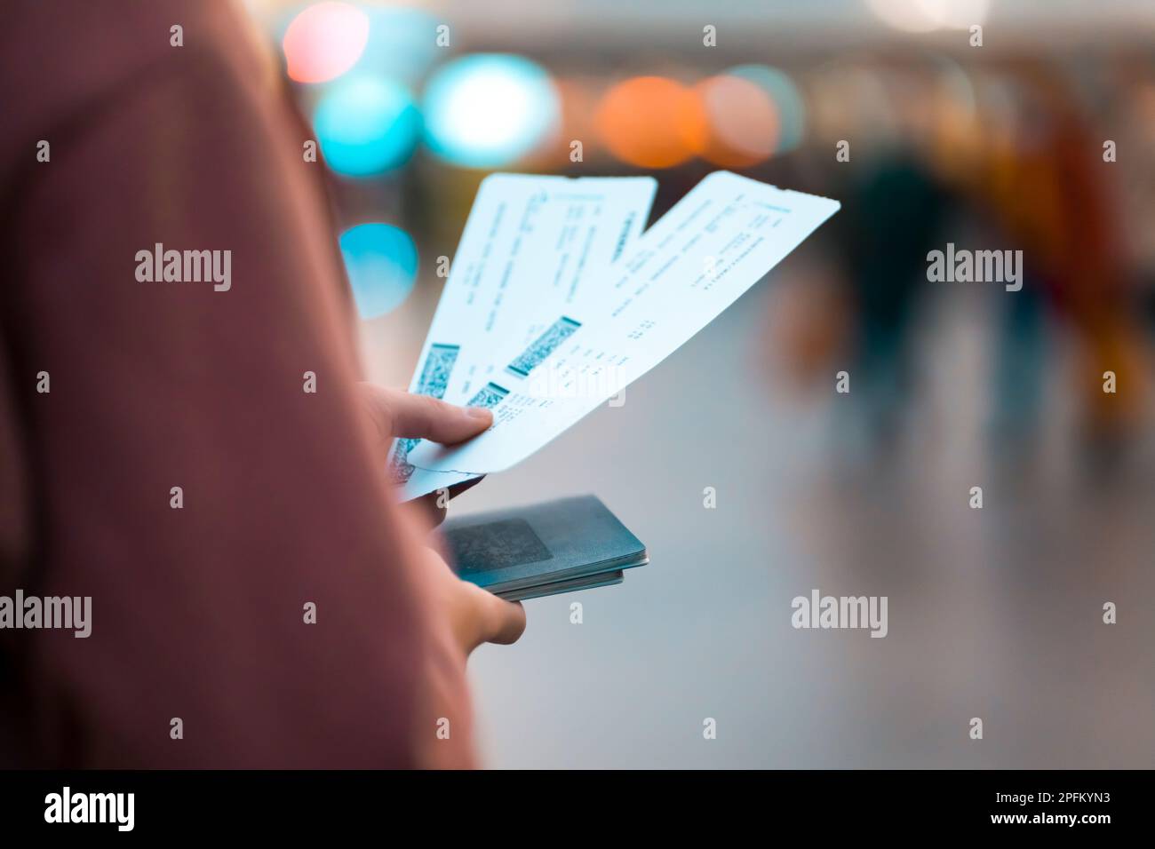 Girl holds tickets, boarding passes for a flight Stock Photo - Alamy