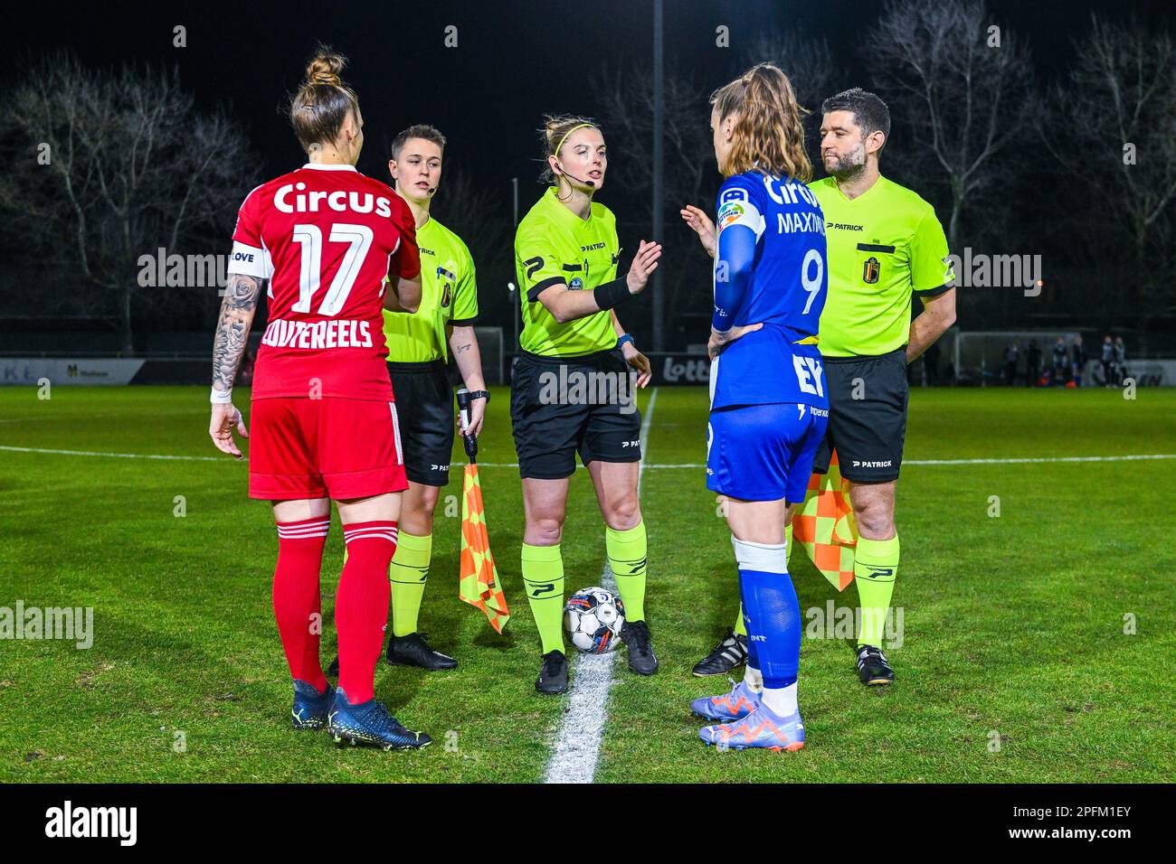 Maud Coutereels (17) of Standard , assistant referee Margot Jacobs ...