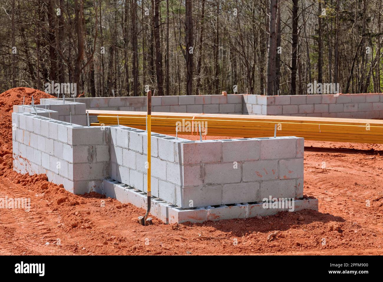 Cement block wall is constructed on construction site to support ...