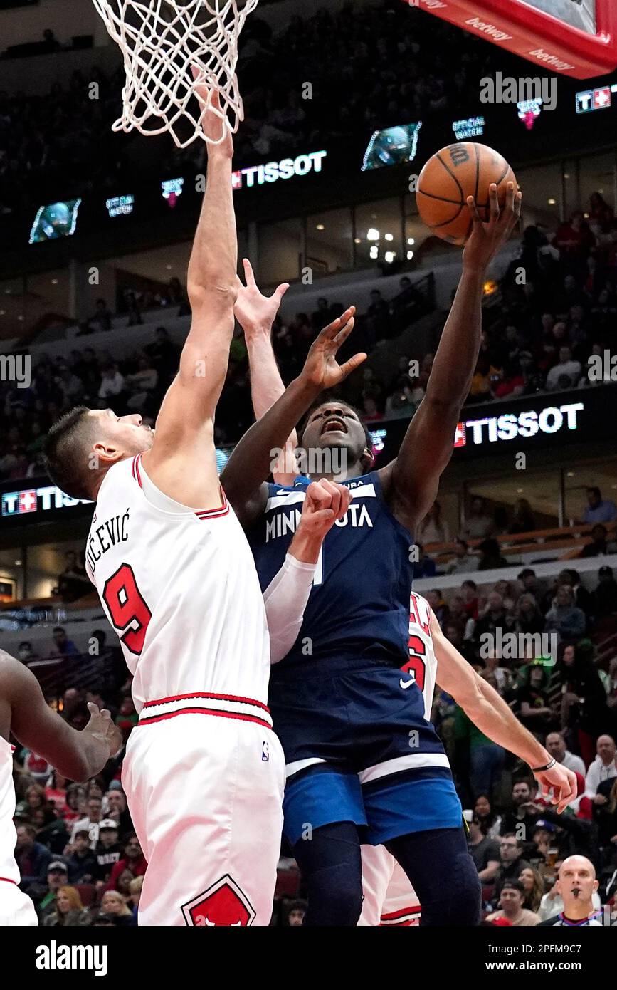 Minnesota Timberwolves guard Anthony Edwards, right, drives to the ...
