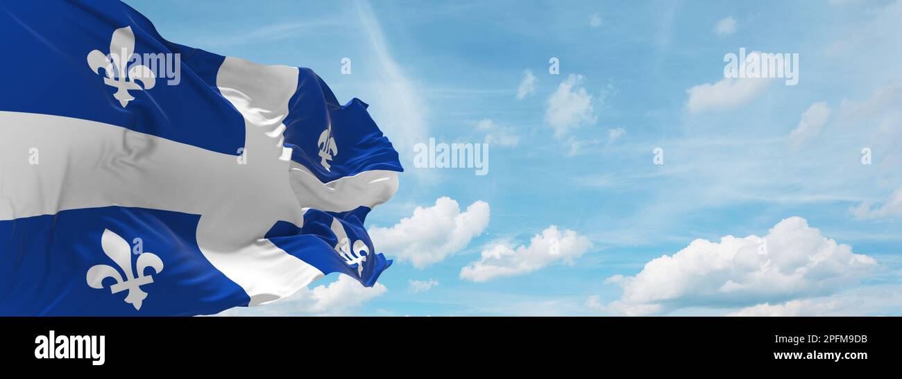 flag of French ancestry Quebecois people at cloudy sky background ...