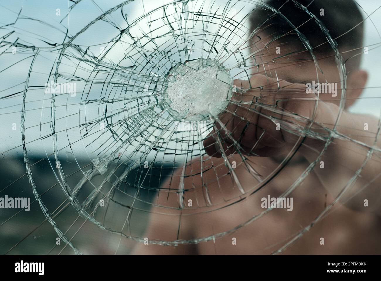 Fist punch. Ready to fight. Man boxing cracked glass, strength and ...