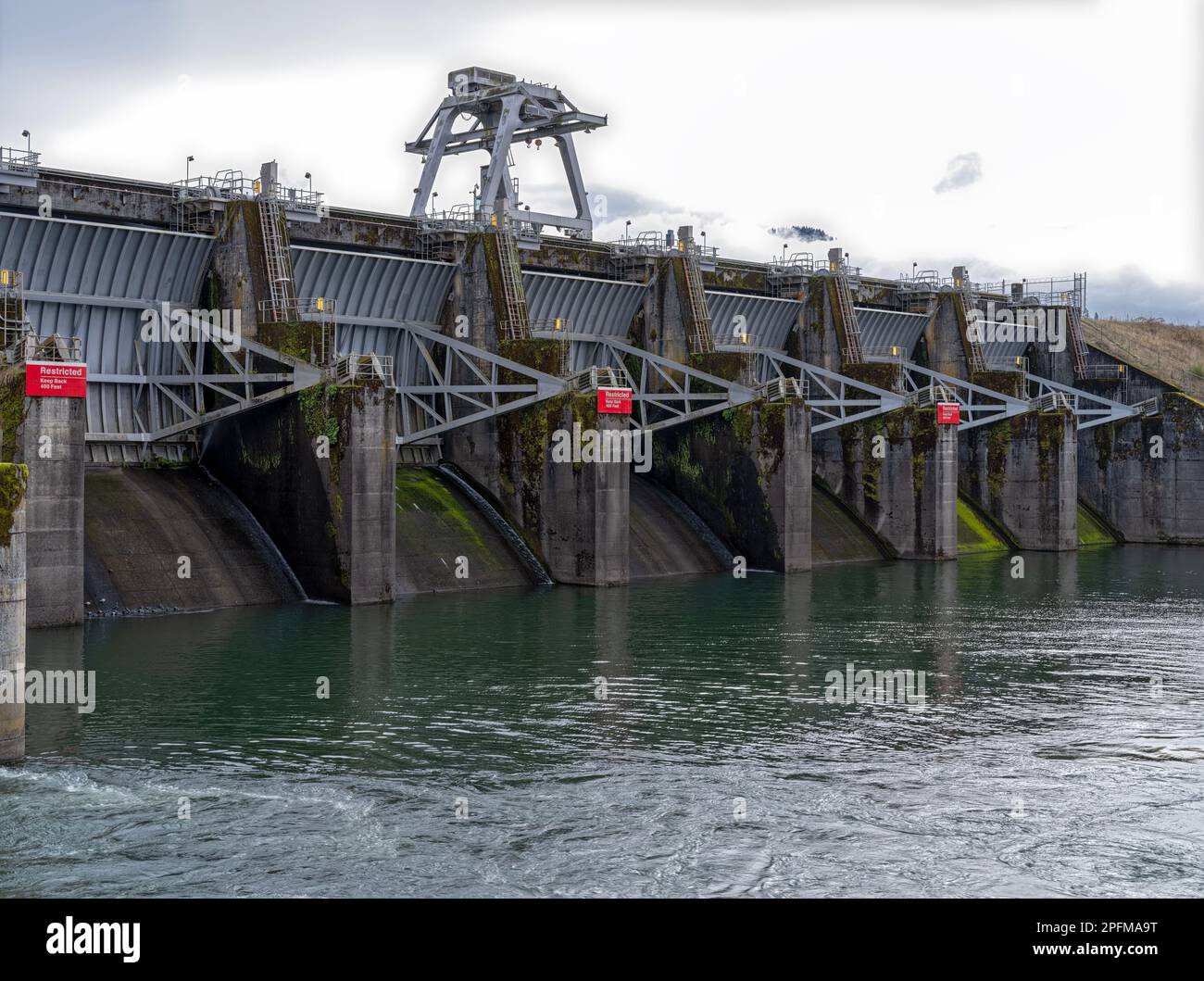 A crane sits atop the gates of the Dexter Dam on the Middle Fork ...