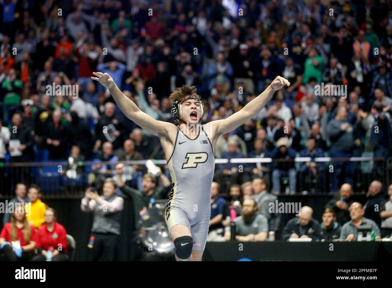 Purdue's Matt Ramos celebrates after pinning Iowa's Spencer Lee, during ...